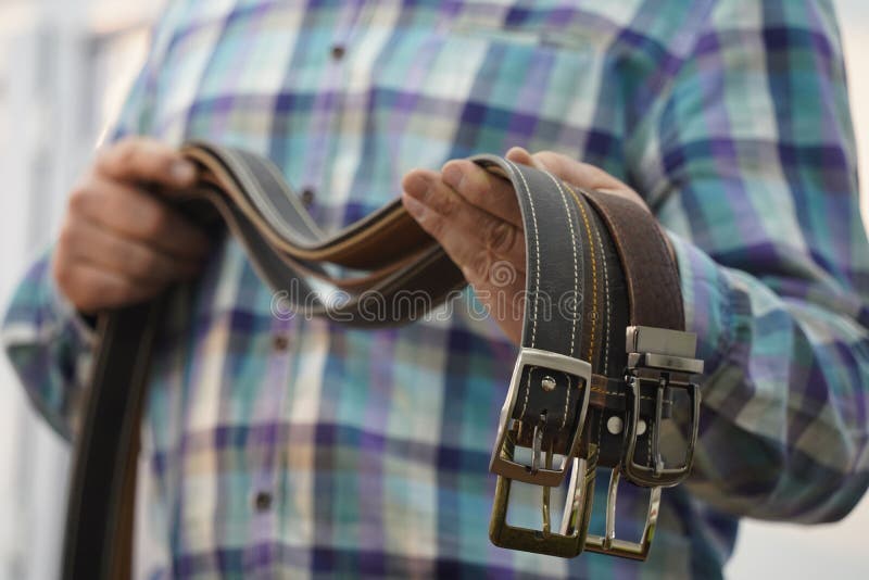 The Master Holds Handmade Leather Belts with Buckles in His Hands Stock ...