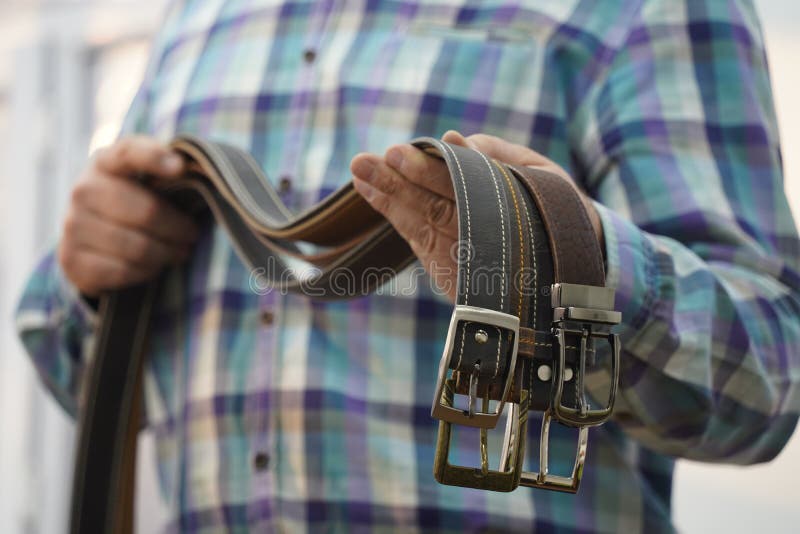 The Master Holds Handmade Leather Belts with Buckles in His Hands Stock ...