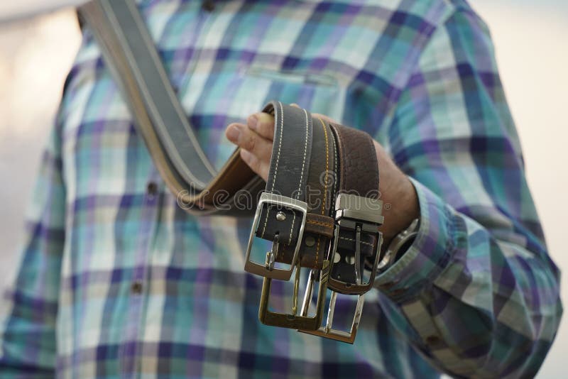 The Master Holds Handmade Leather Belts with Buckles in His Hands Stock ...
