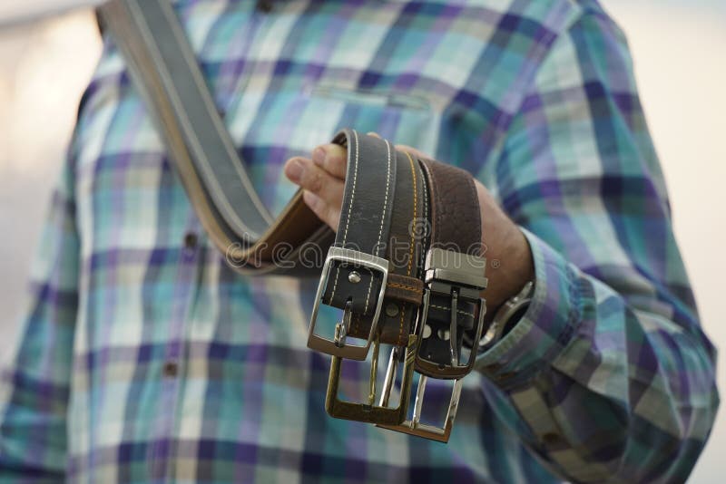 The Master Holds Handmade Leather Belts with Buckles in His Hands Stock ...