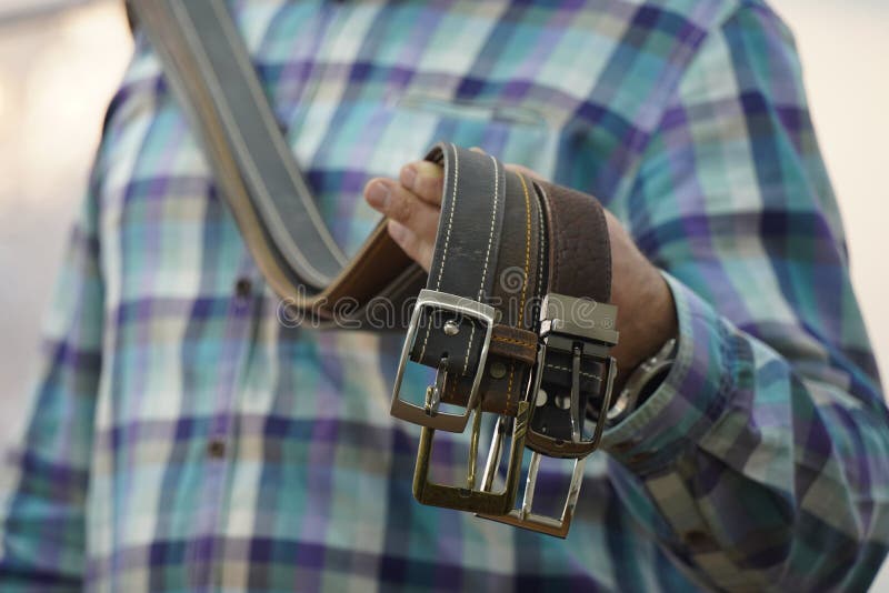 The Master Holds Handmade Leather Belts with Buckles in His Hands Stock ...