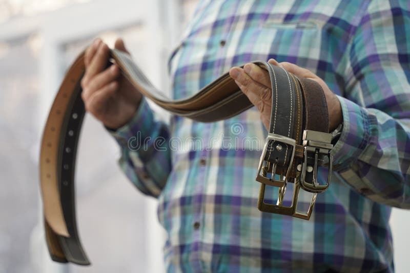 The Master Holds Handmade Leather Belts with Buckles in His Hands Stock ...