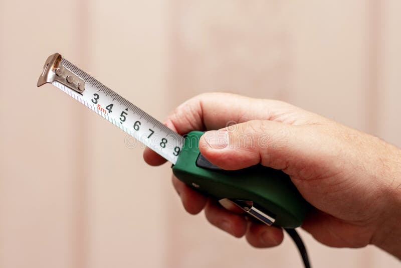 The Master Holds a Tape Measure in His Hand Stock Image - Image of ...