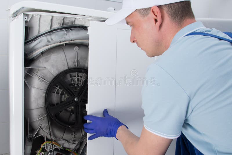The Master Installs the Wall of the Washing Machine, after Repair Stock ...