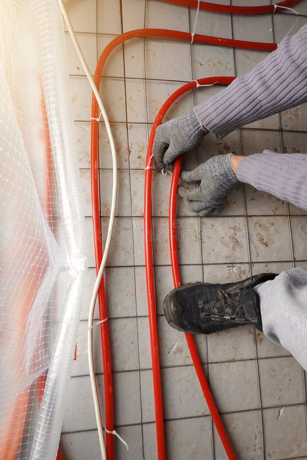 The Master Laid Pipes on the Floor for Heating and Floor Heating Stock ...