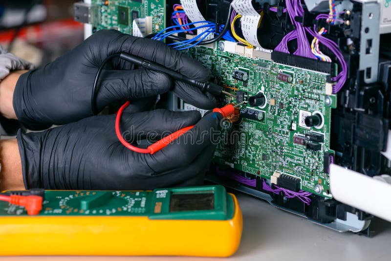Master is Looking for Damage, Repair Office Equipment Using Multimeter ...
