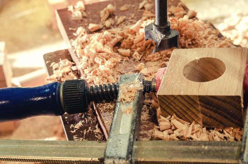 The Master Makes a Hole in the Wooden Blank. Stock Photo - Image of ...