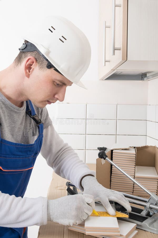 The Master Makes Markings on Ceramic White Tiles for Cutting, Finishing ...