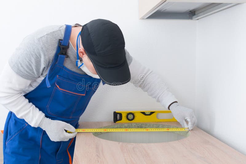 The Master Makes Measurements of the Hole before Installing the Sink ...