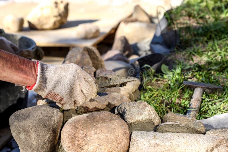 Hands of an Old Master Mason Stock Image - Image of paver, hammer ...