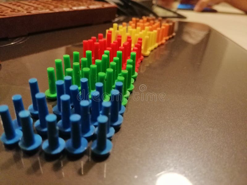 Master mind pegs in line stock photo. Image of master - 172043354