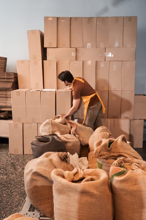 Master Packing Boxes while Standing at the Warehouse Stock Photo ...