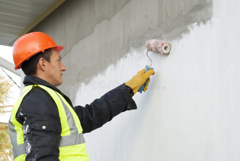 Master paints the wall stock image. Image of equipment - 136541253