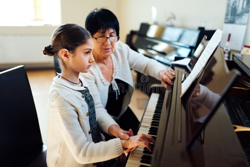 Piano Lessons at Music School, Teacher and Student. Stock Photo - Image ...