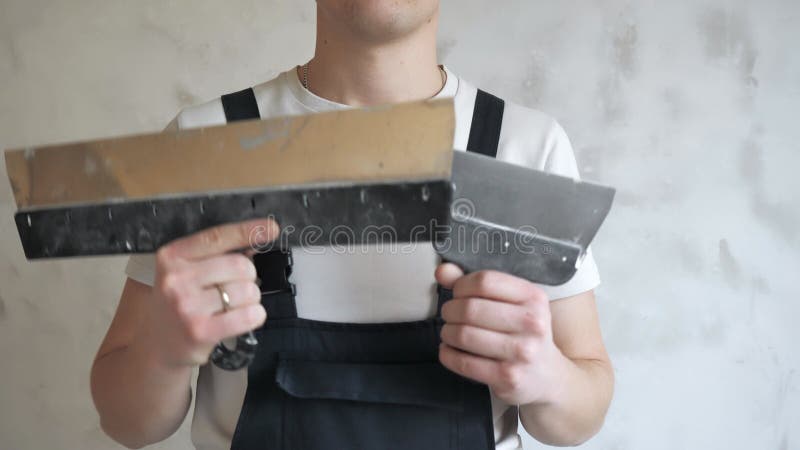 Master Plasterer Shows the Spatulas To the Camera with a Desire To Get ...