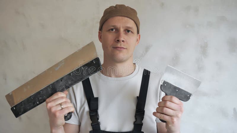 Master Plasterer Shows the Spatulas To the Camera with a Desire To Get ...
