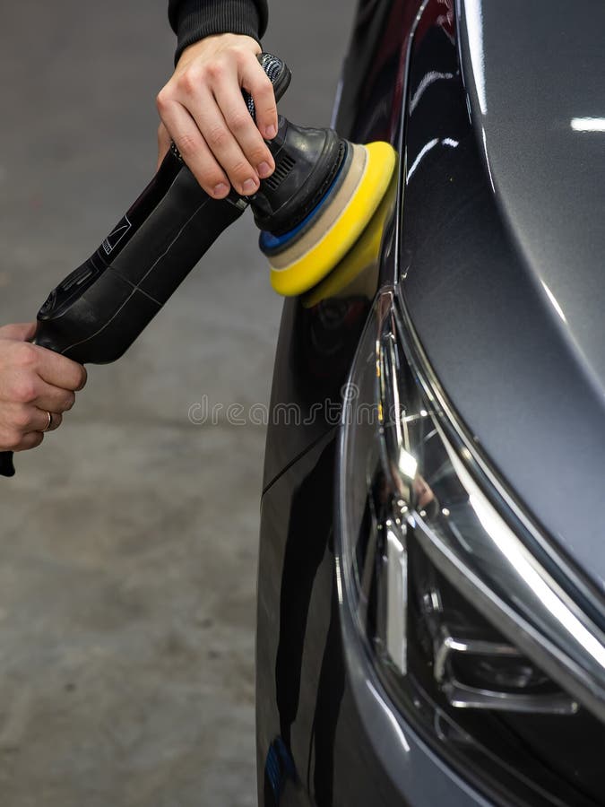 A Master Polishes the Surface of a Car Body. Stock Image - Image of ...