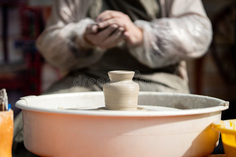 Master Potter Makes a Clay Pot on a Potter S Wheel Made of Clay Stock ...