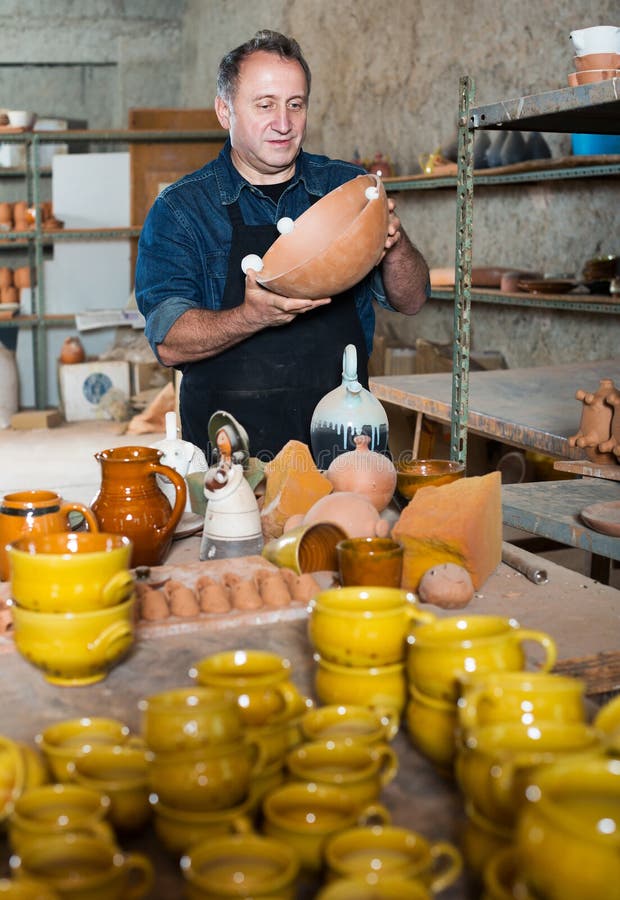 Master among the pottery stock photo. Image of ceramic - 226626964