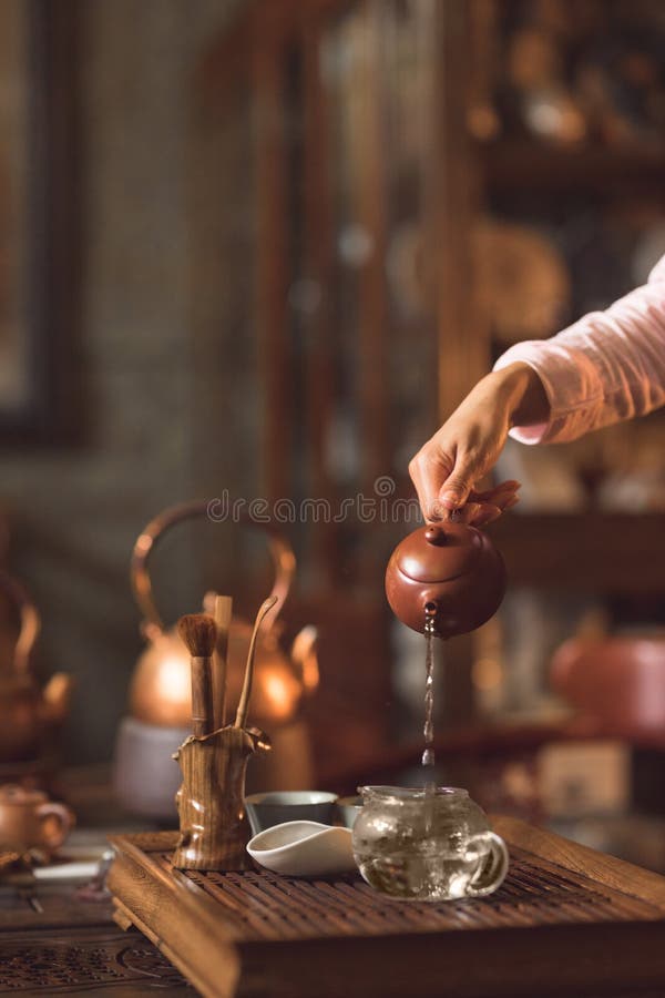 Master Pouring Tea from a Teapot Stock Photo - Image of asian, girl ...