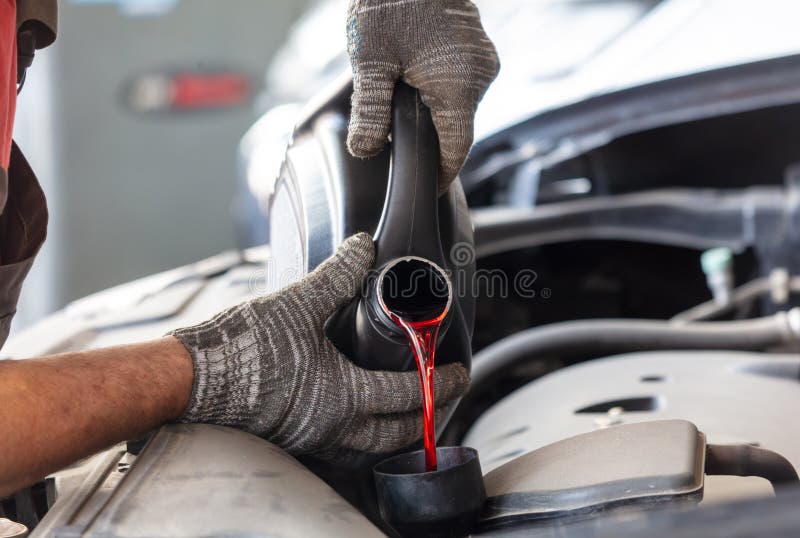 The Master Pours Oil into the Car& X27;s Variator Stock Image - Image ...