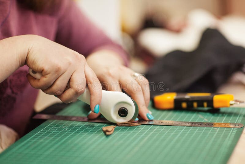 The Master Prepares the Details of the Cut for the Garment Stock Image ...