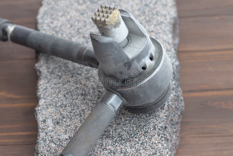 The Master Processes Granite Using a Special Tool. Close-up Stock Image ...