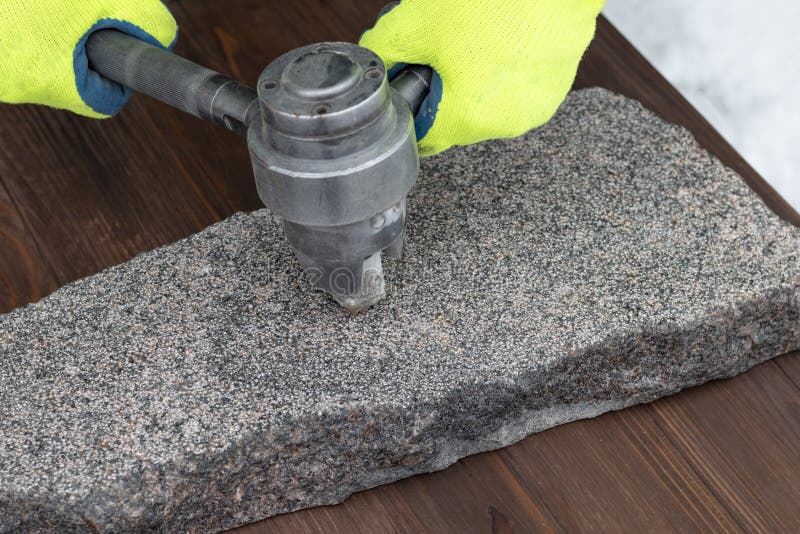 The Master Processes Granite Using a Special Tool. Close-up Stock Image ...