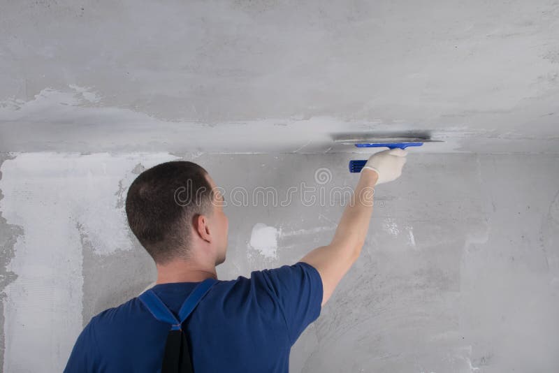 The Master Puts a Finishing Putty on the Ceiling Stock Photo - Image of ...