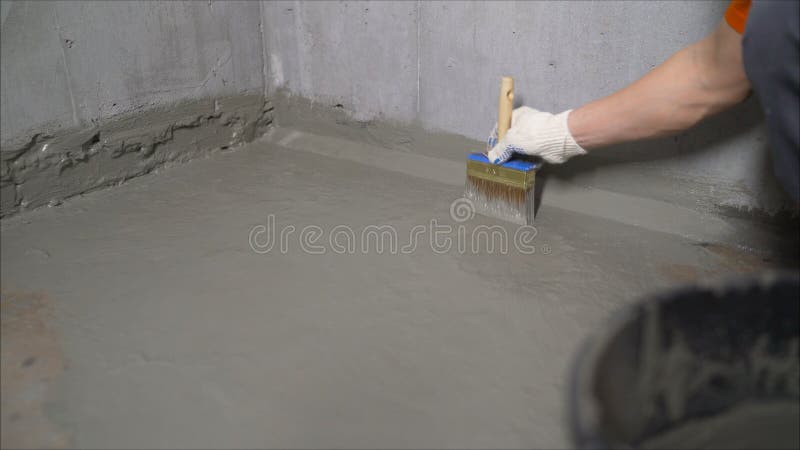 Waterproofing Concrete Mortar. the Master Puts Waterproofing on a ...