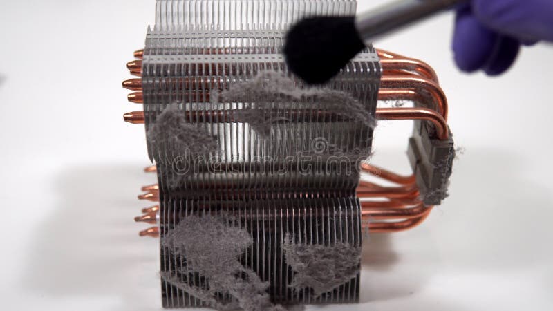The Master Repairman with a Brush Cleans Dust from the Heatsink of the ...