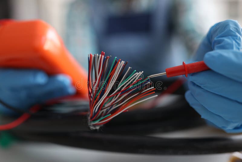 Master Repairman Testing Multicolored Wires from Cable Using Tester ...