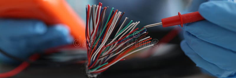 Master Repairman Testing Multicolored Wires from Cable Using Tester ...