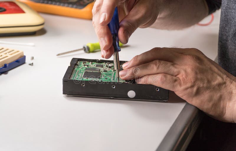 Master repairs chip stock photo. Image of device, disc - 144463578