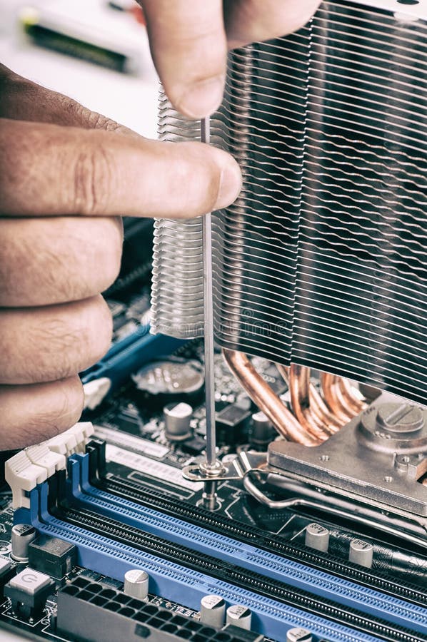 The Master Screws on the Cooler for the Computer, the Filter is ...