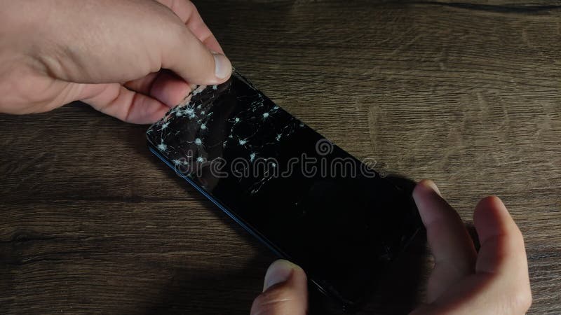 The Master in the Service Center Changes the Broken Glass of the Screen ...