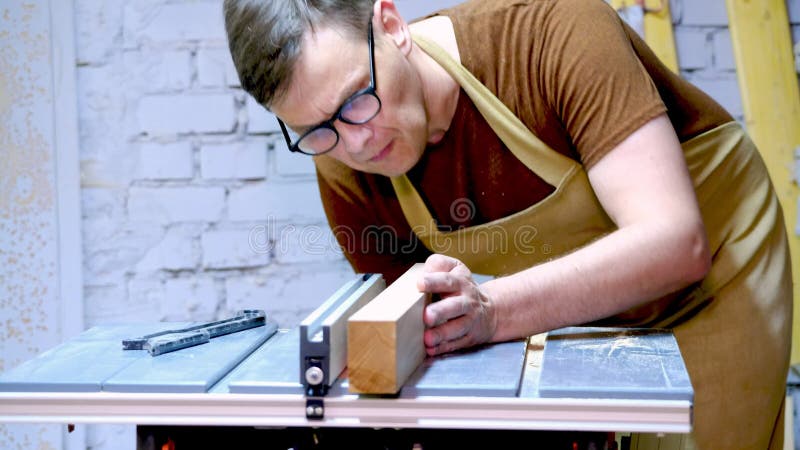 The Master Sets the Board on a Circular Saw Stock Footage - Video of ...