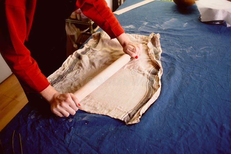 Master Shapes Pottery on a Blue Canvas.Creative Process. Gives Shape To ...