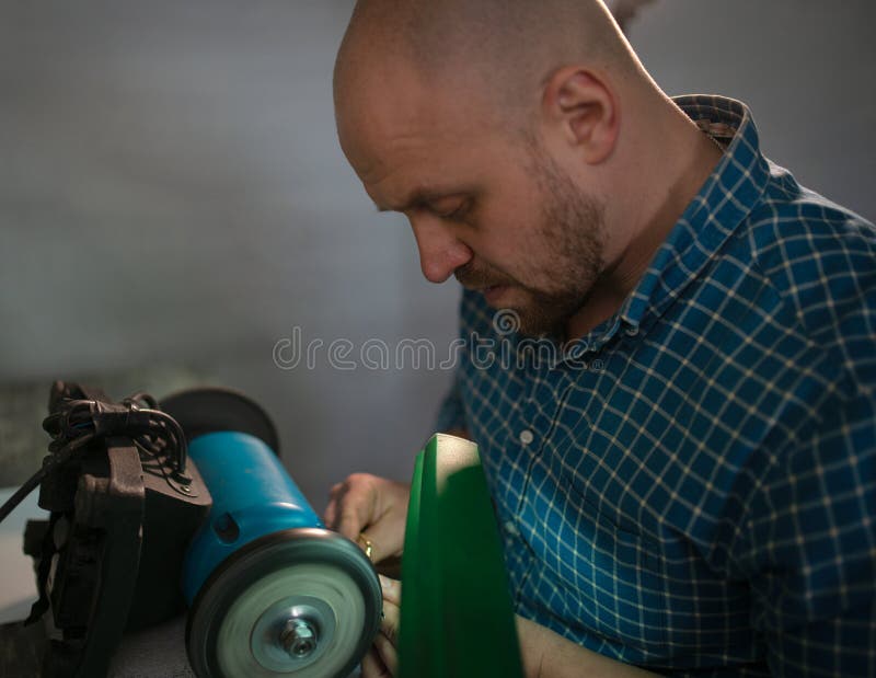 Master Sharpens Scissors on Special Equipment for Sharpening Tool Stock ...