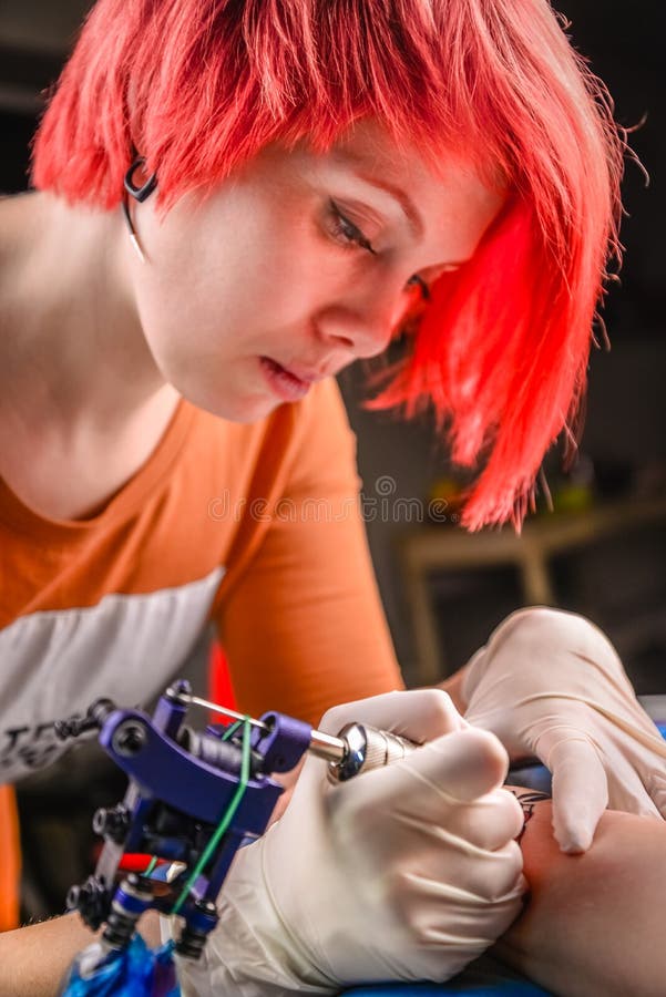 Professional Tattoo Artist Showing Process of Making a Tattoo Stock ...