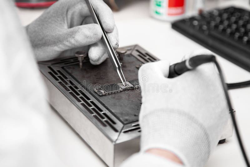 The Master Solders the Microchip.. Service Center. Repair of ...