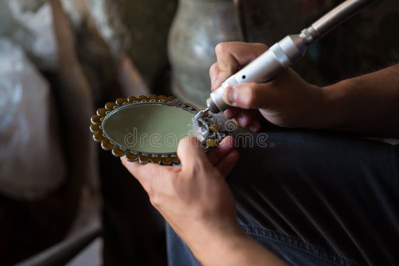 The Master the Special Tool Puts Drawing on a Mirror.Engraving on ...