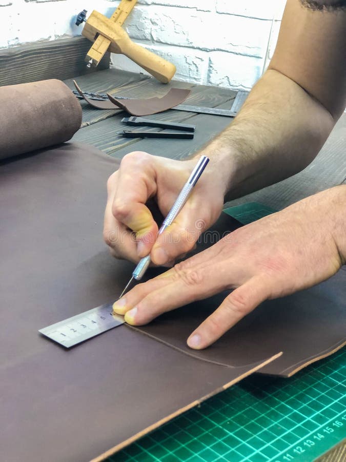 Master Stitches the Workpiece, Hand Stitch Needle on the Skin Stock ...