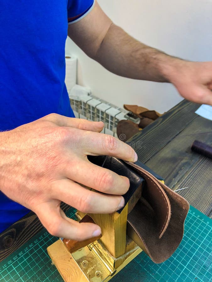 Master Stitches the Workpiece, Hand Stitch Needle on the Skin Stock ...