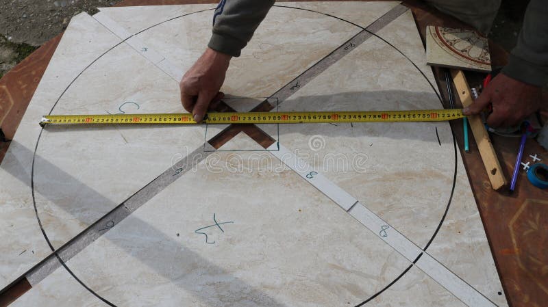 A Master Takes Measurements with a Ruler on the Top of a Homemade Table ...