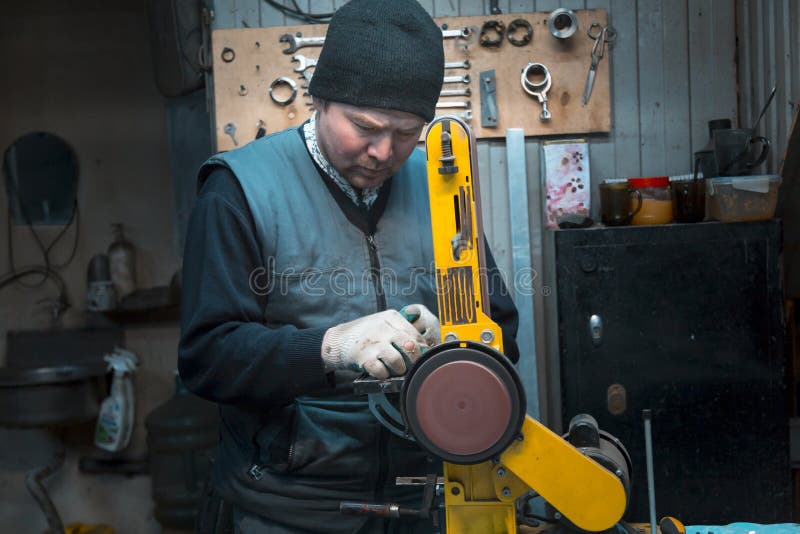 Locksmith Processes a Part on an Emery Machine Stock Photo - Image of ...