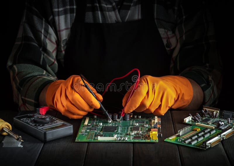 Master Tester Checks the Electronic Board in the Workshop. Computer or ...