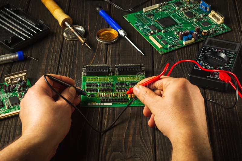 The Master Tester Checks the Electronic Board in the Workshop. Computer ...