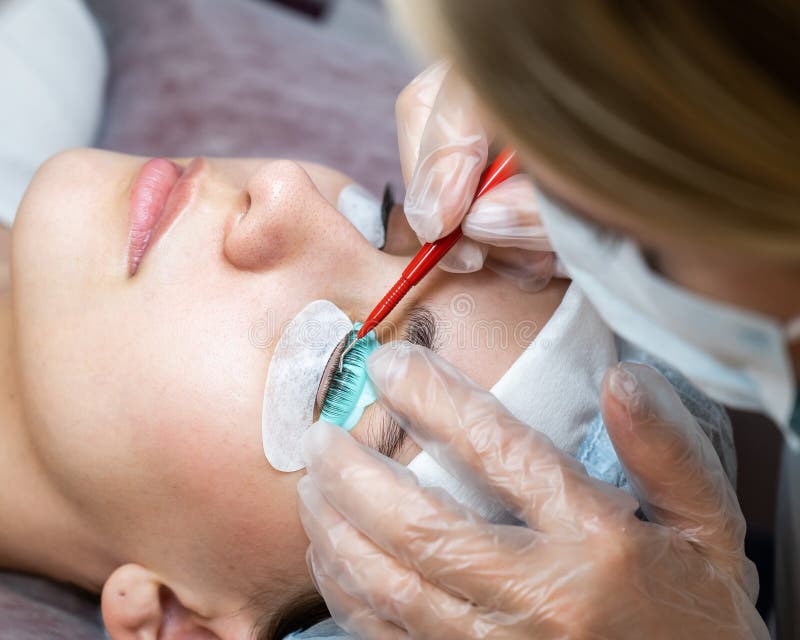 The Master Uses a Multifunctional Tool for Laminating Eyelashes. Stock ...