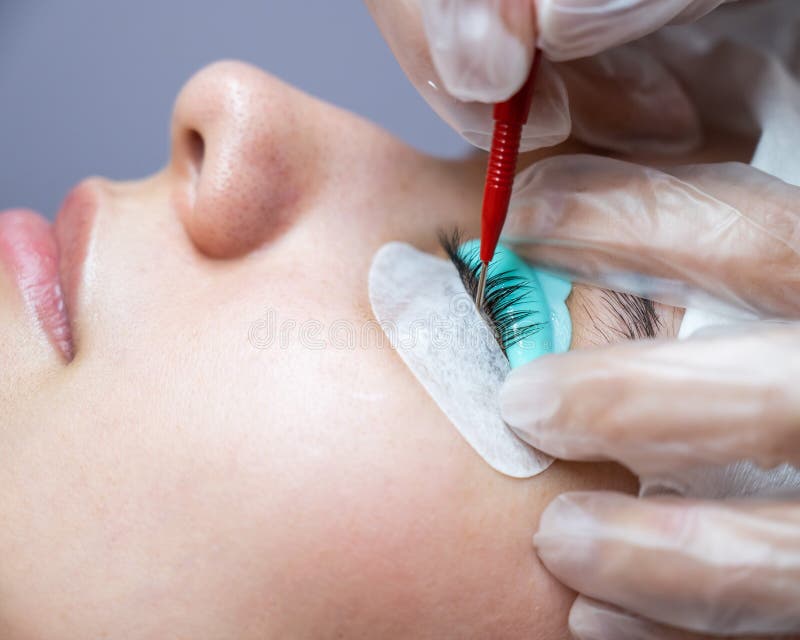 The Master Uses a Multifunctional Tool for Laminating Eyelashes. Stock ...